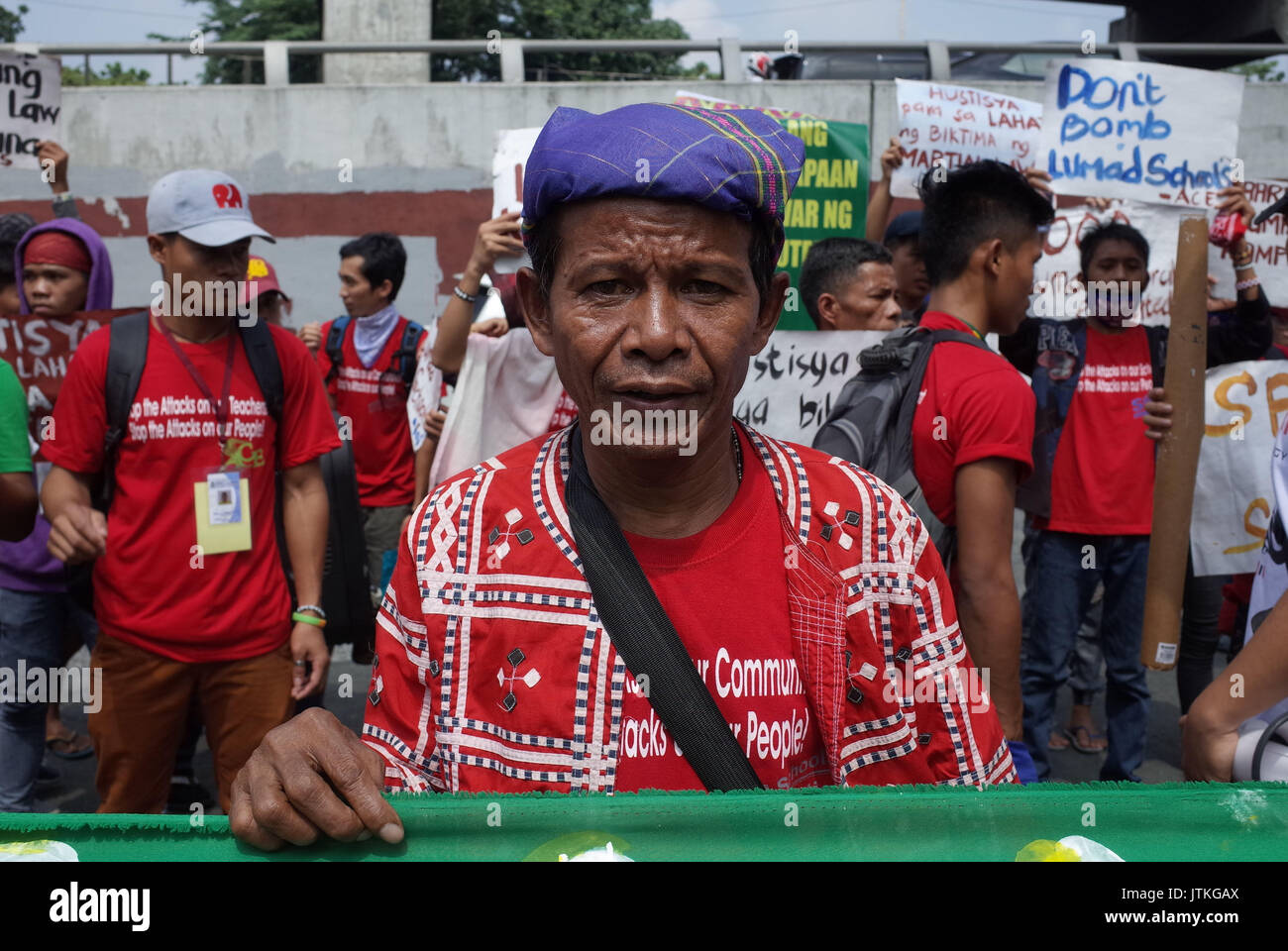 A Manobo indigenous tribesman poses for a photograph during a rally ...