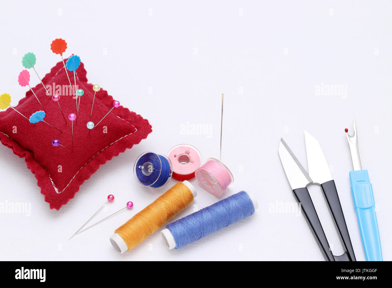 sewing tools, tailoring and fashion concept - closeup on white ...