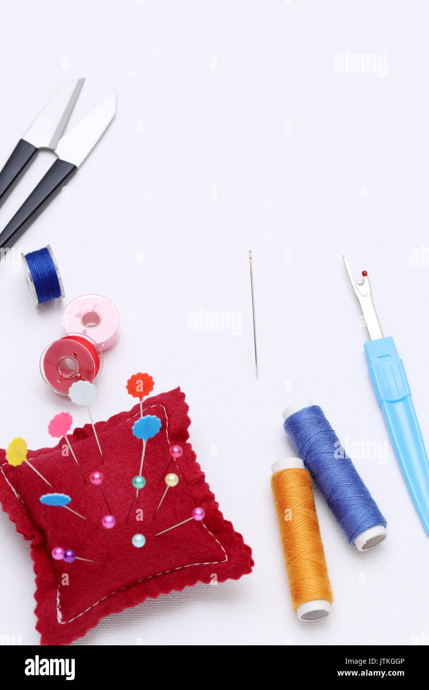 sewing tools, tailoring and fashion concept - closeup on white ...
