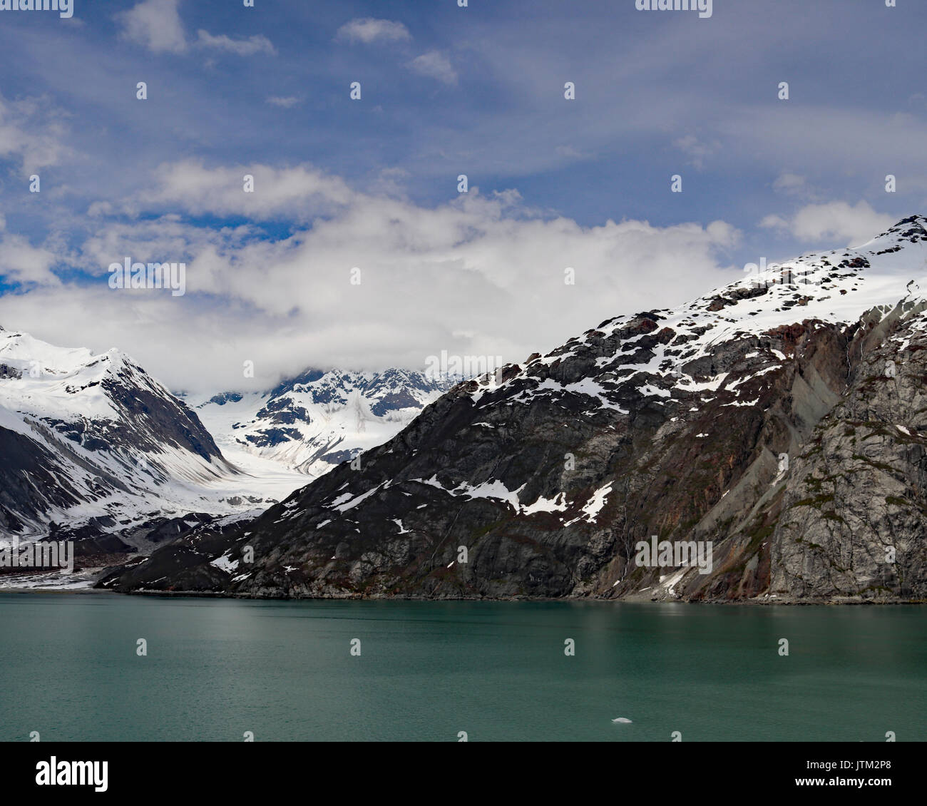 Mountain peaks against cloudy hi-res stock photography and images - Alamy