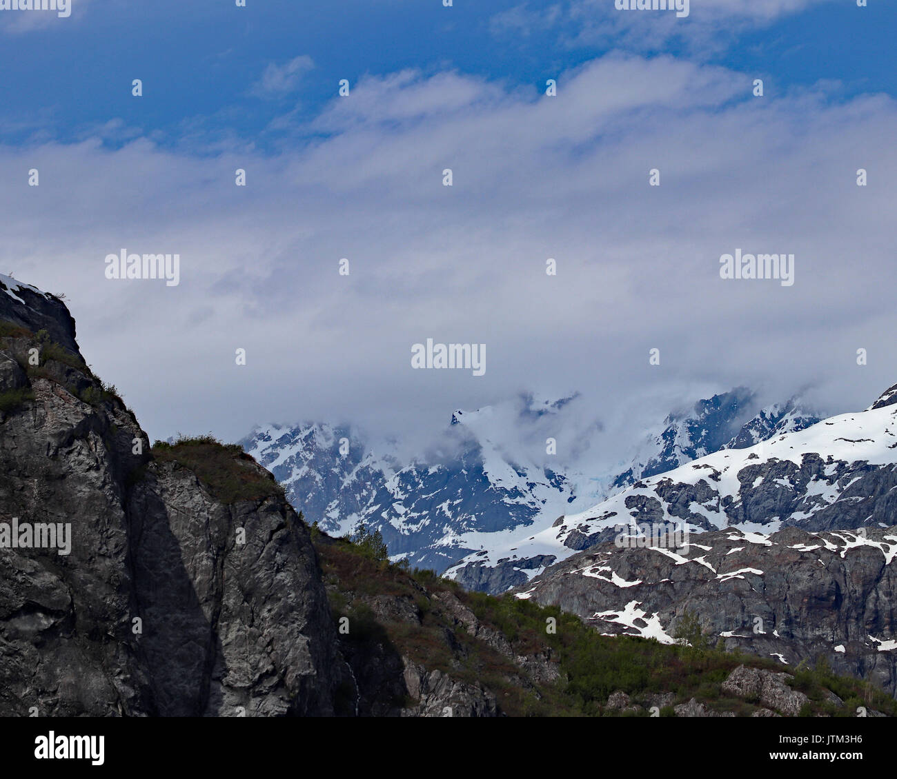 Clouds hanging over mountains hi-res stock photography and images - Alamy