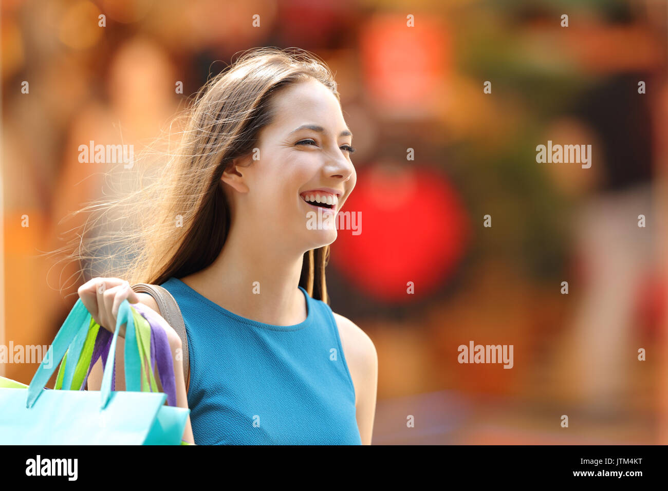 Female shopper walking with bags hi-res stock photography and images ...
