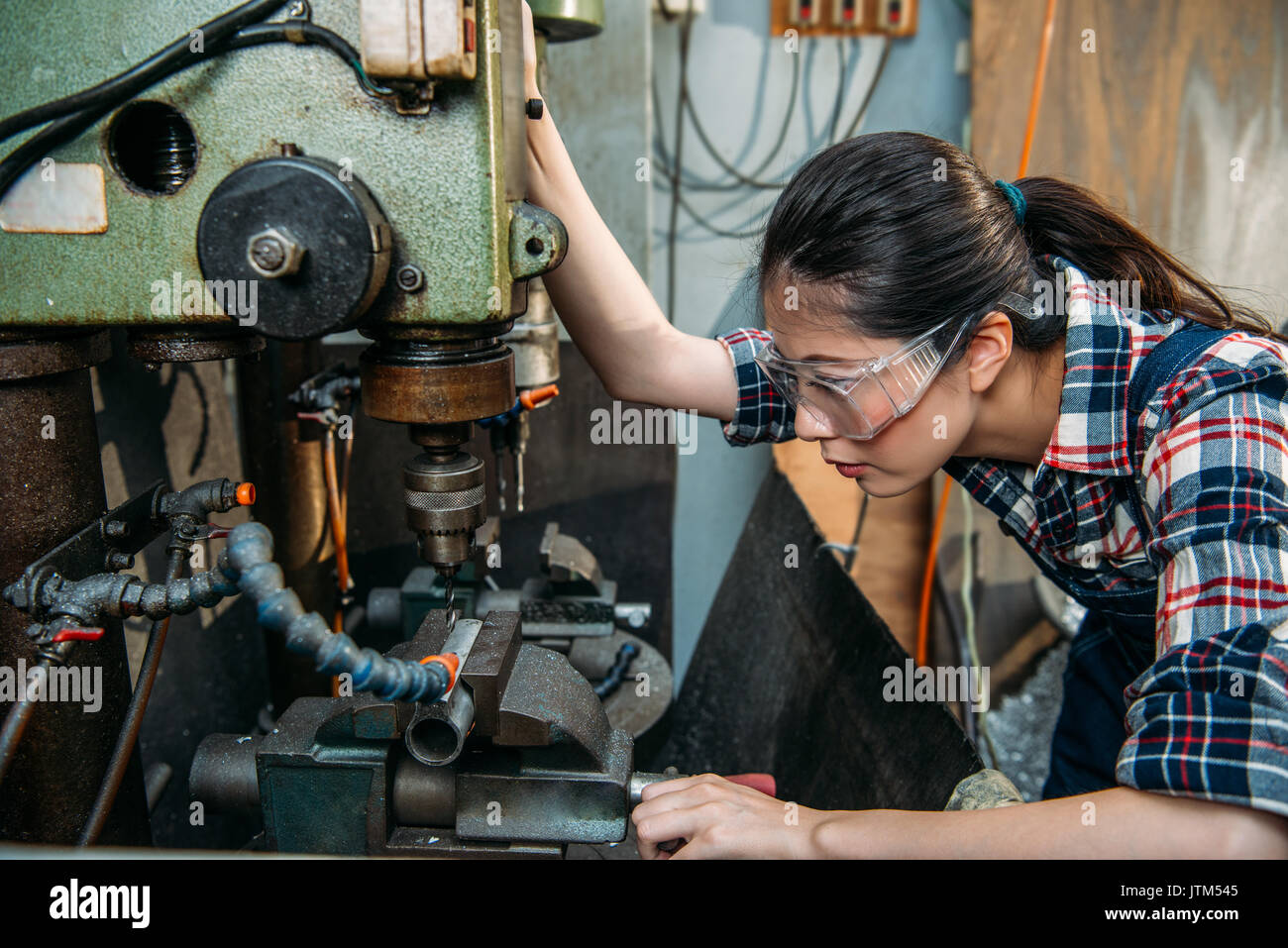 seriously industrial factory woman wearing safety protection glasses ...