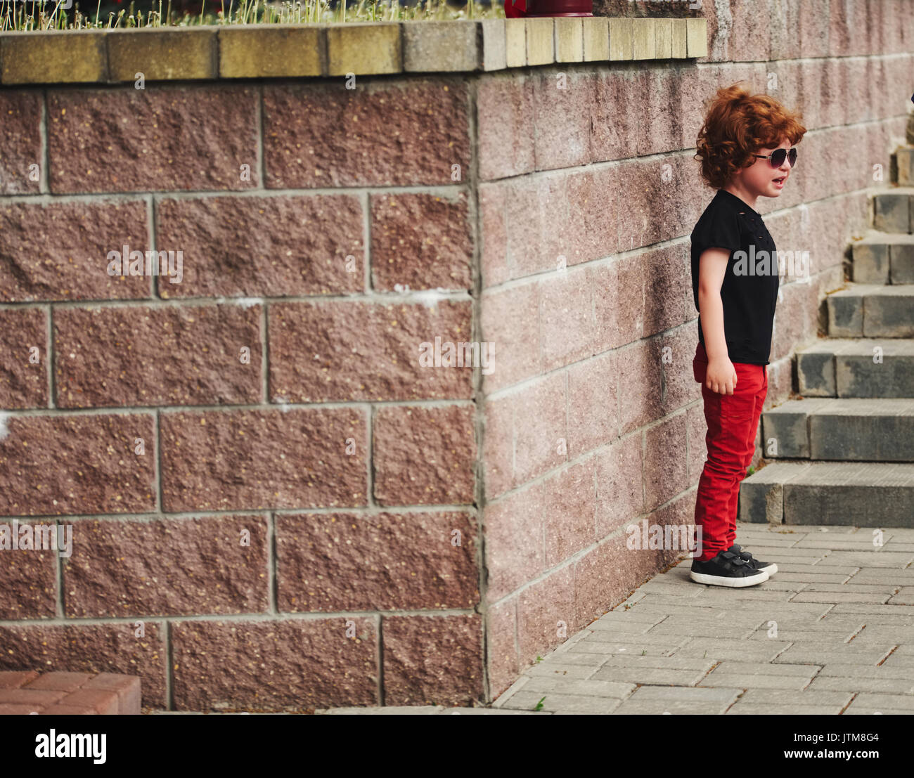 little crying boy with red hair Stock Photo - Alamy