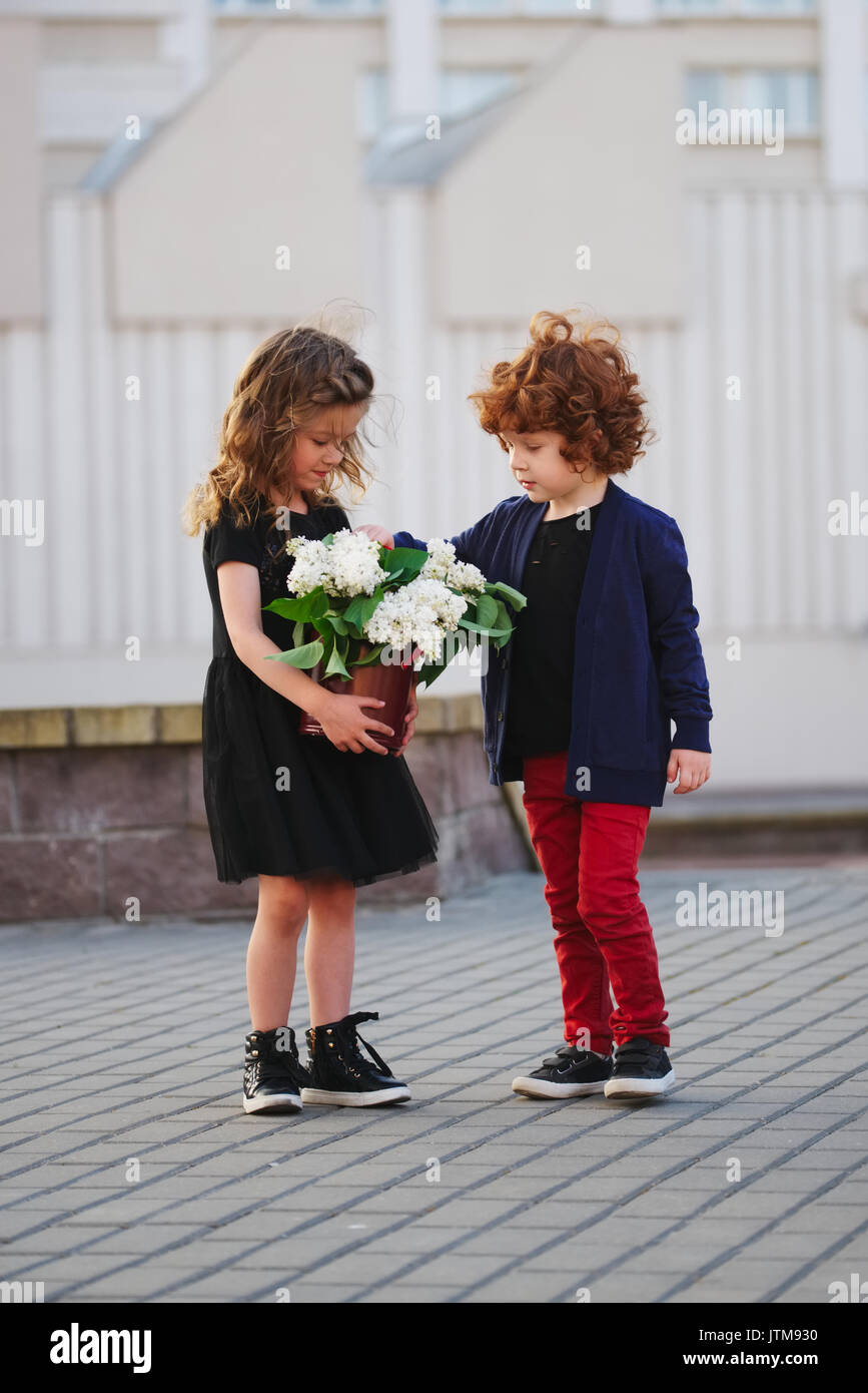 Two kids boy carry girl hi-res stock photography and images - Alamy