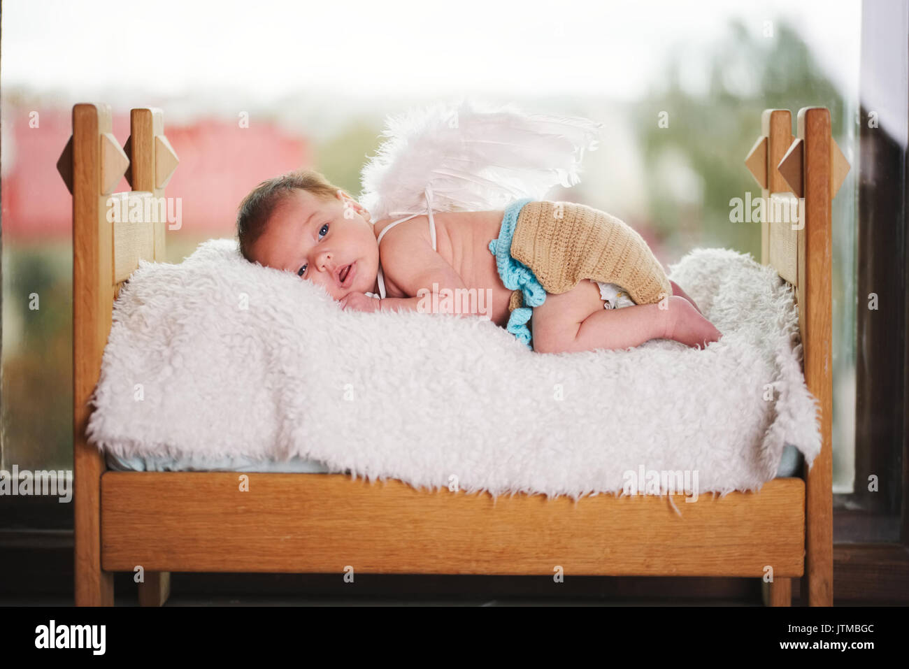 cute little cupid with wings Stock Photo - Alamy