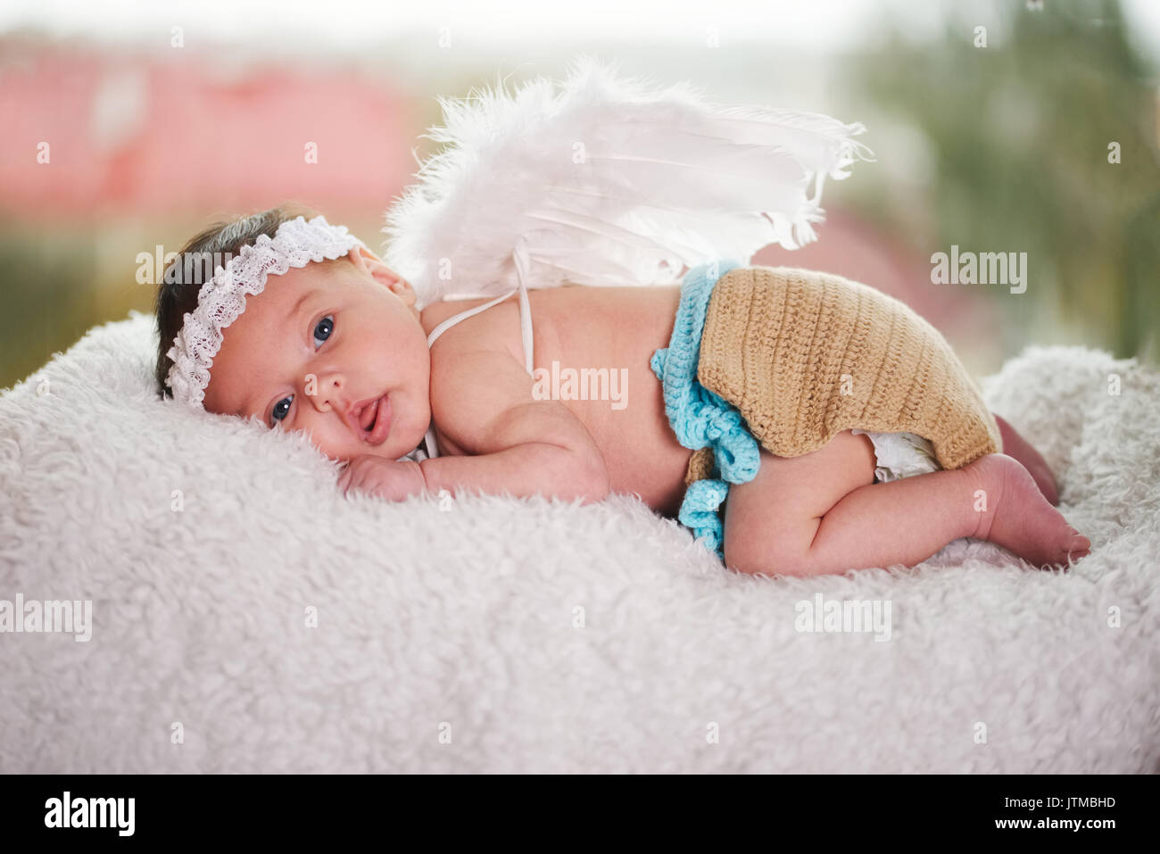 cute little cupid with wings Stock Photo - Alamy