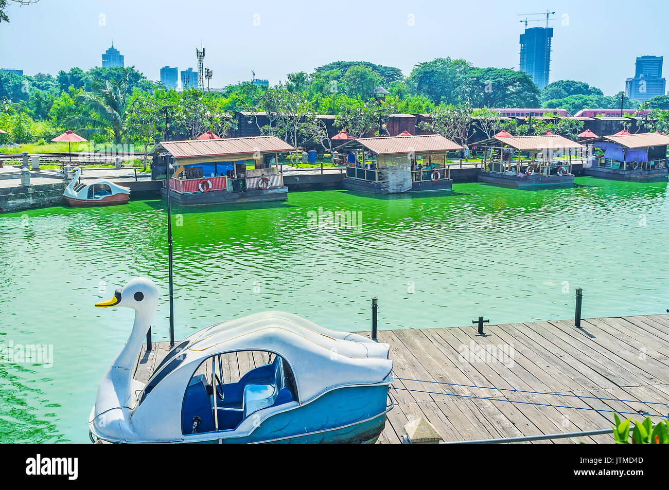 The swan catamaran on embankment of Beira lake with the pavilions of ...