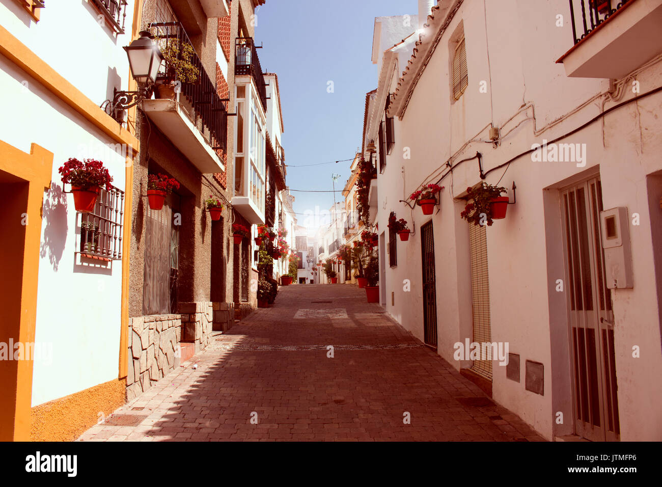 Street. Beautiful Spanish house. Flowers and trees Stock Photo - Alamy