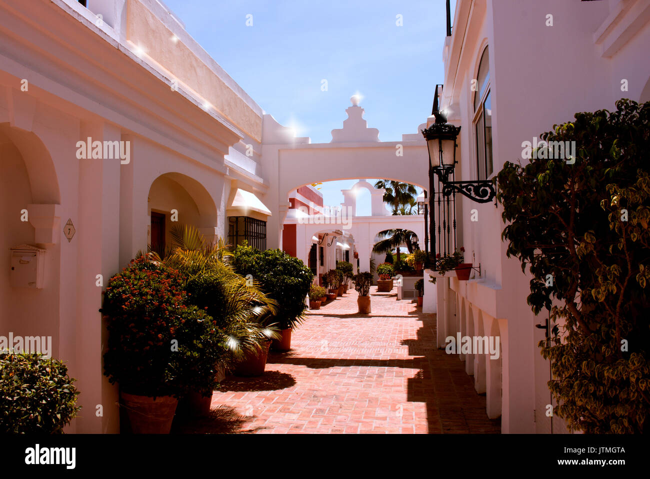Street. Beautiful Spanish house. Flowers and trees Stock Photo - Alamy