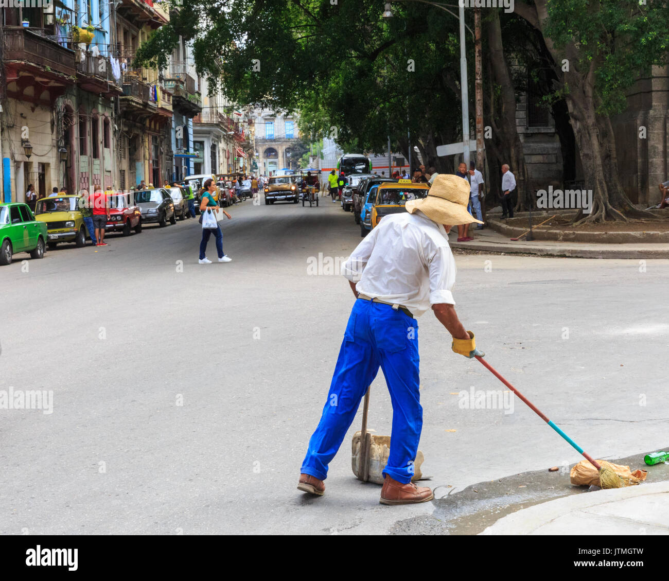 Street cleaner sweeping the pavement in Habana Vieja, Havana, Cuba ...