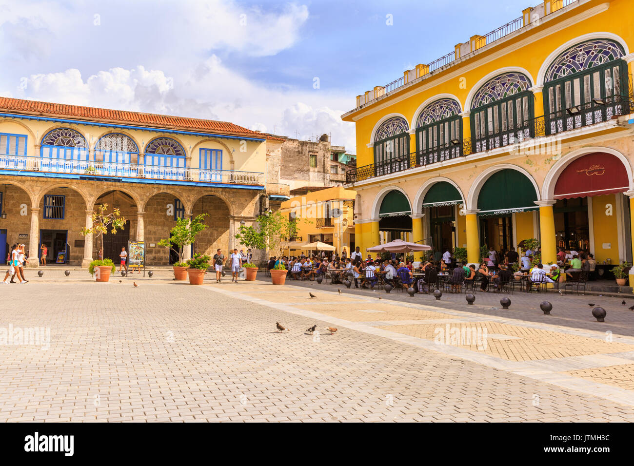 Restored historic architecture, people in restaurants and cafes in La ...