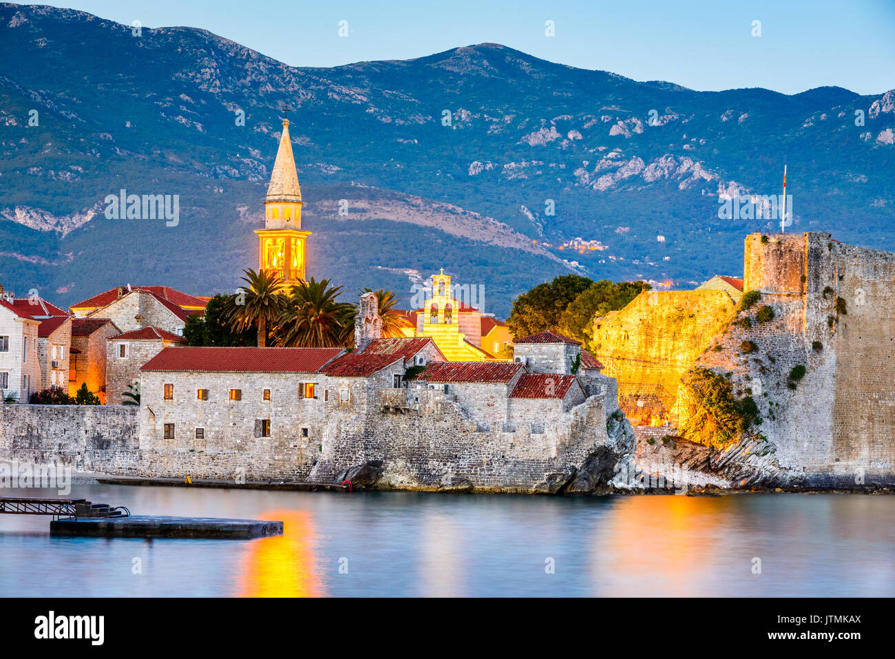 Budva, Montenegro. Ancient walls with Adriatic Sea, illuminated in ...