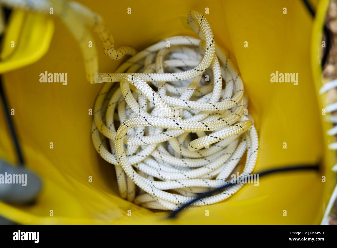 Climbing rope inside a yellow backpack Stock Photo - Alamy