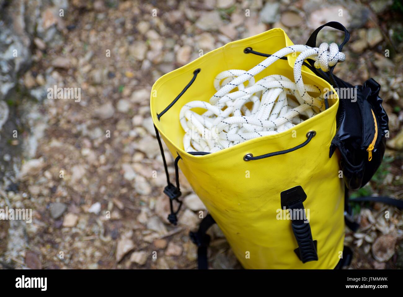 Climbing rope inside a yellow backpack Stock Photo - Alamy