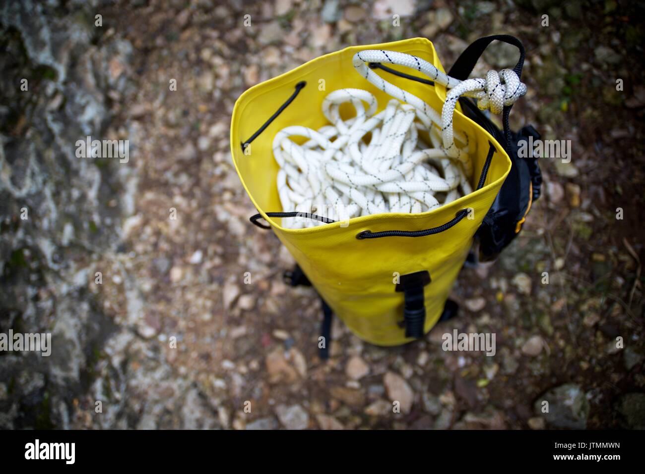 Climbing rope inside a yellow backpack Stock Photo - Alamy