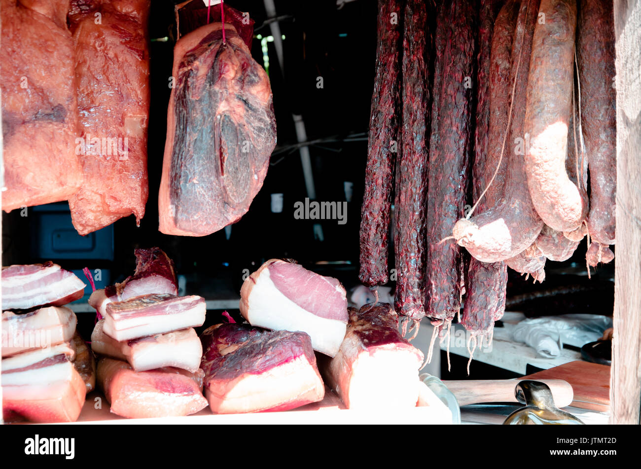Sausage and ham, market scene Stock Photo - Alamy