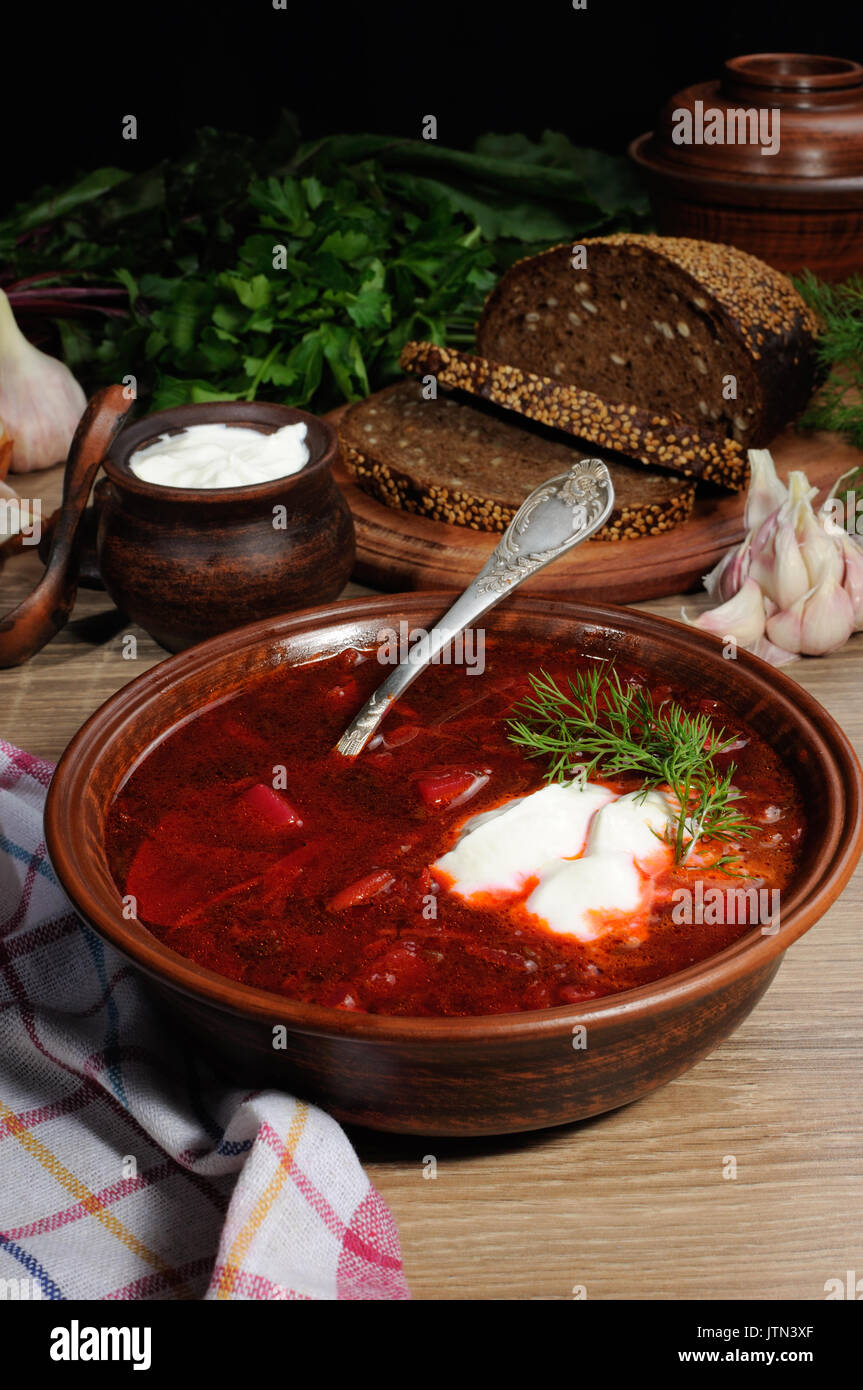 Borscht-vegetable beetroot soup, on the table with slices of rye cereal ...