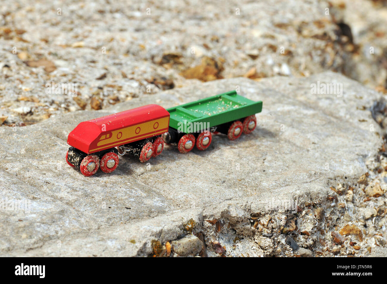 a child's or children's toy train wooden truck abandoned and forgotten ...