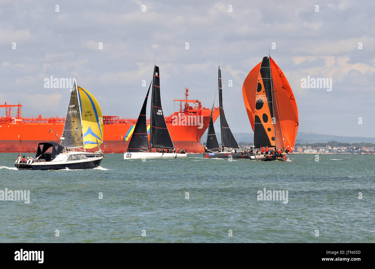 yachts racing off of Cowes on the isle of wight during the annual cowes ...