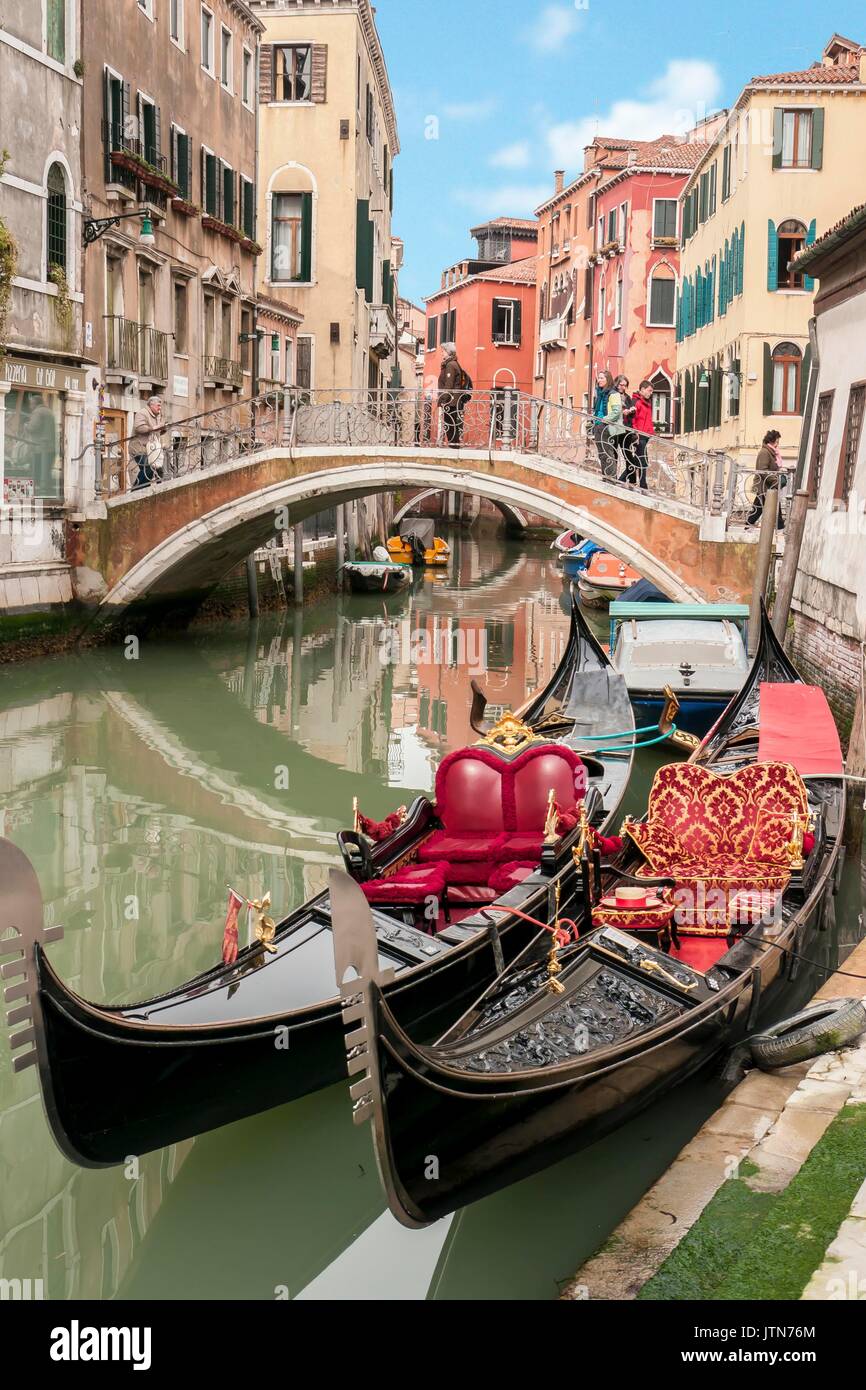 Two Gondolas in a Venetian canal with a traditional bridge in the ...
