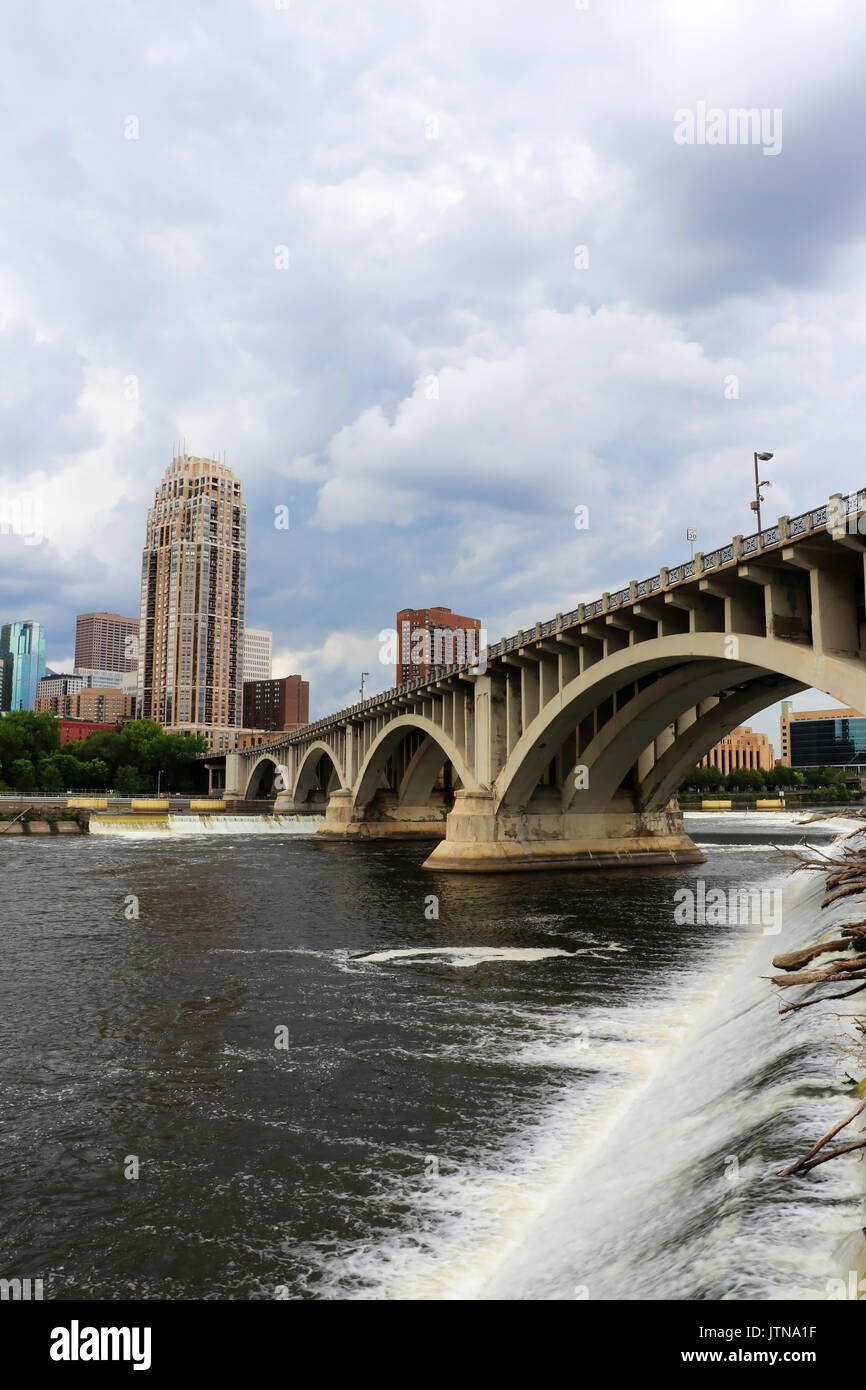 Minneapolis downtown skyline and Third Avenue Bridge above Saint ...