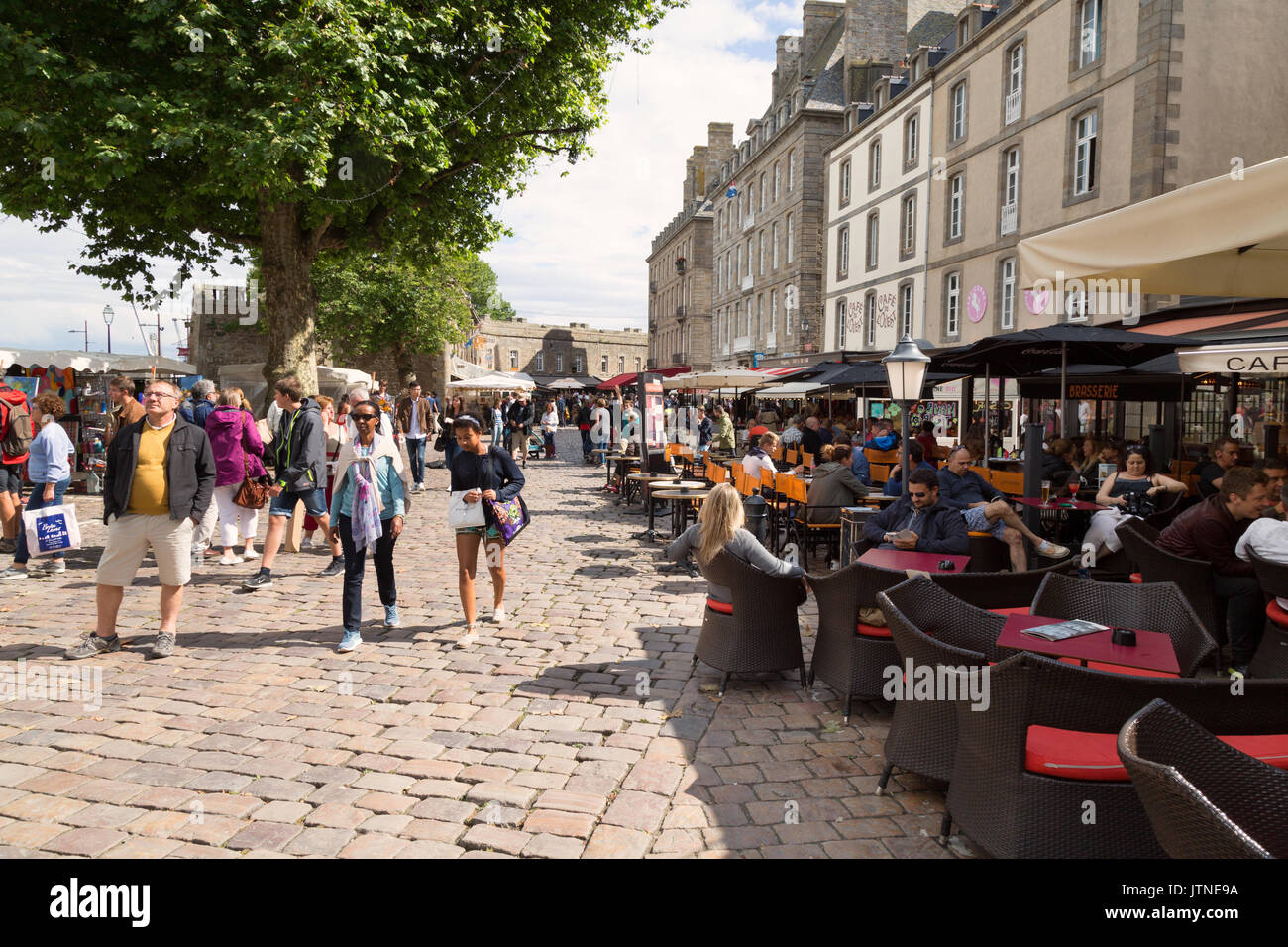 St Malo walled town, - tourists walking in the old town in summer ...