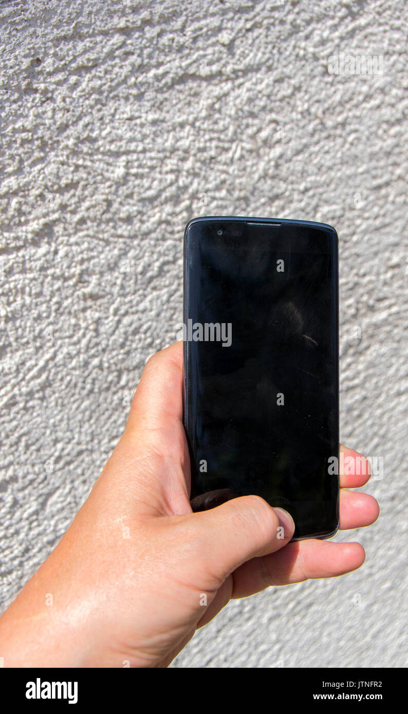 Mobile phone in hand. Cell phone Stock Photo - Alamy