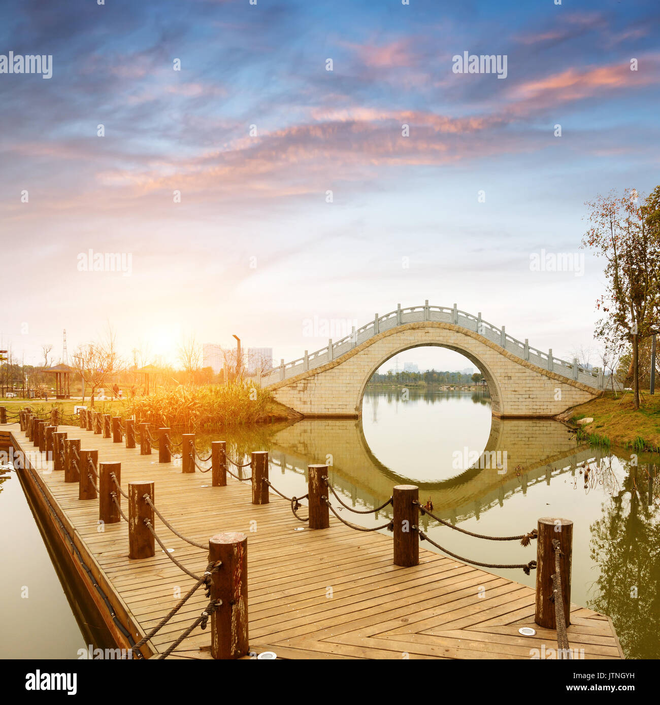Antique arch bridge and wood corridor, Hangzhou, China Stock Photo - Alamy