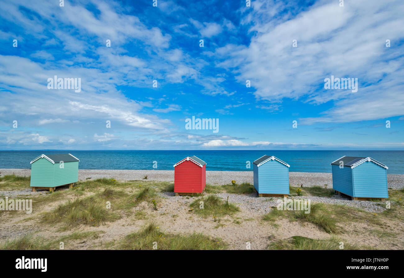 FOUR PASTEL COLOURED BEACH HUTS ON THE SAND AND SHINGLE BEACH FINDHORN ...