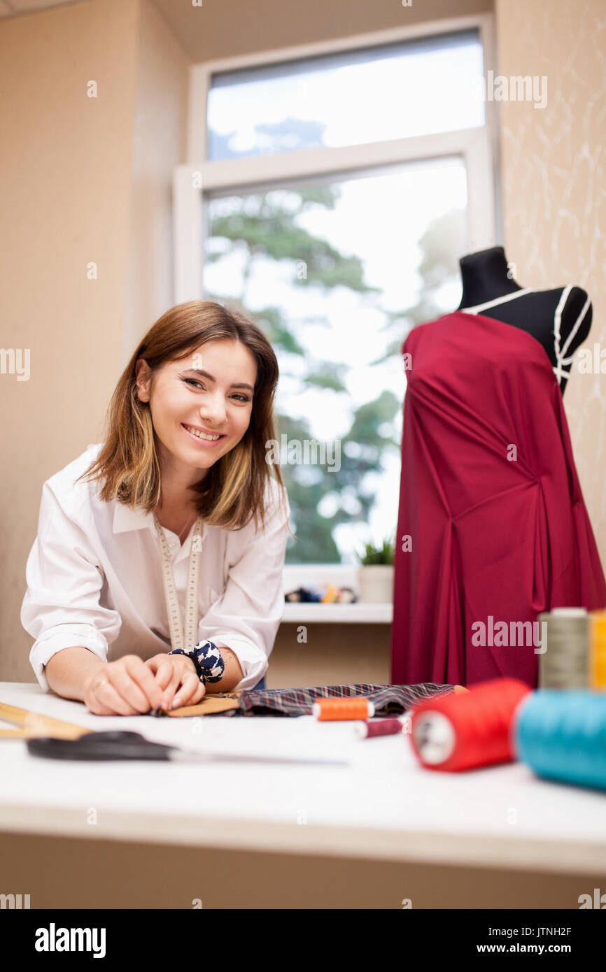 Fashion designer in her studio Stock Photo - Alamy