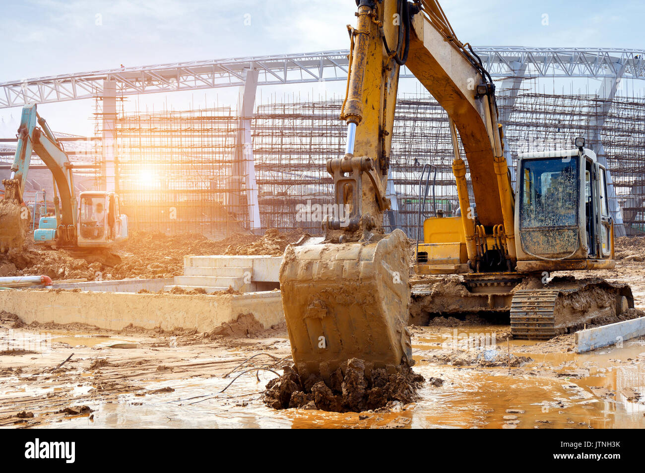 The excavator is working excavation site construction Stock Photo - Alamy