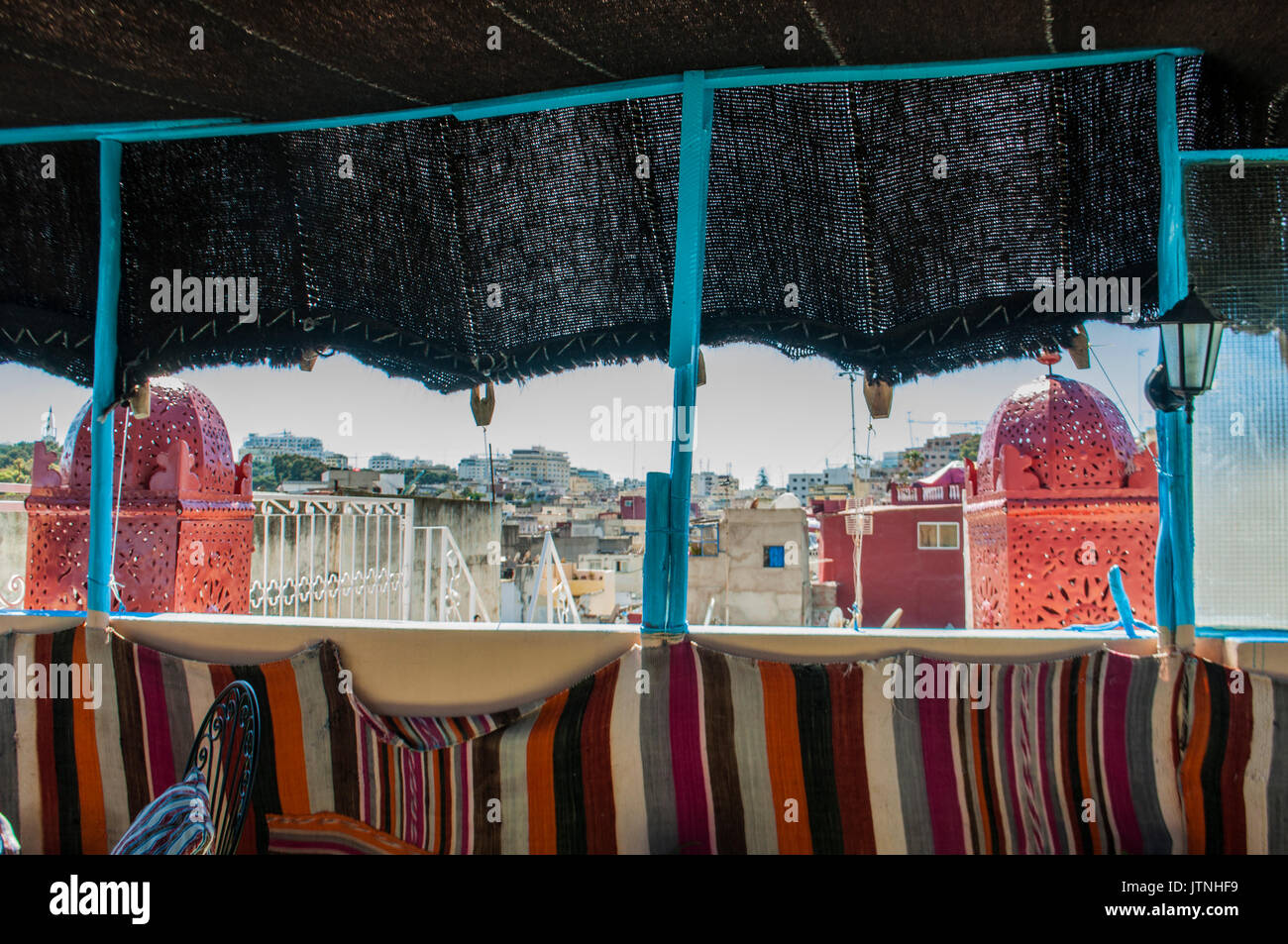 A typical moroccan terrace with view on the roofs and the skyline of ...