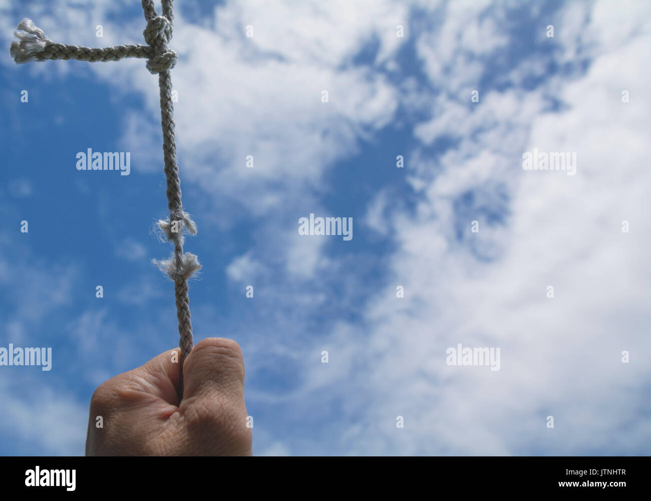 Two hands pulling rope hi-res stock photography and images - Alamy