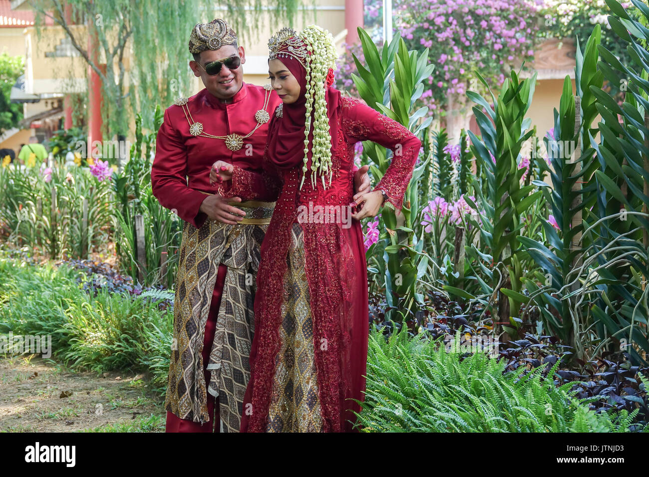 Traditional javanese wedding couple bride and bridegroom at garden ...