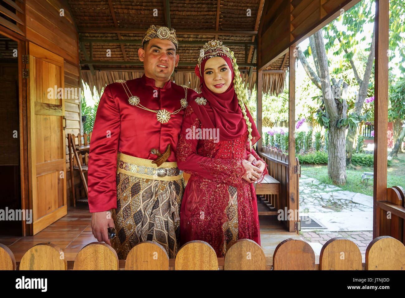 Traditional javanese wedding couple bride and bridegroom at garden ...