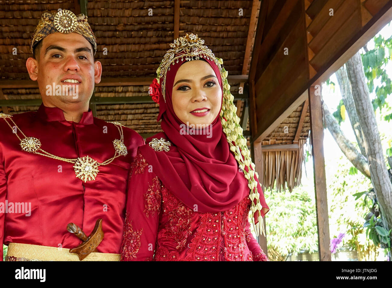 Traditional javanese wedding couple bride and bridegroom at garden ...