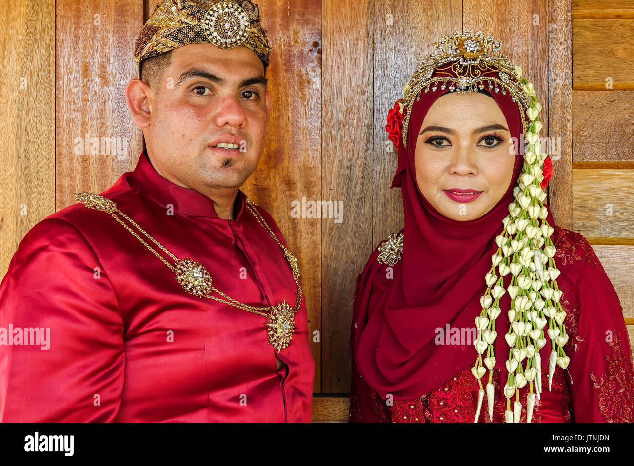 Traditional javanese wedding couple bride and bridegroom at garden ...