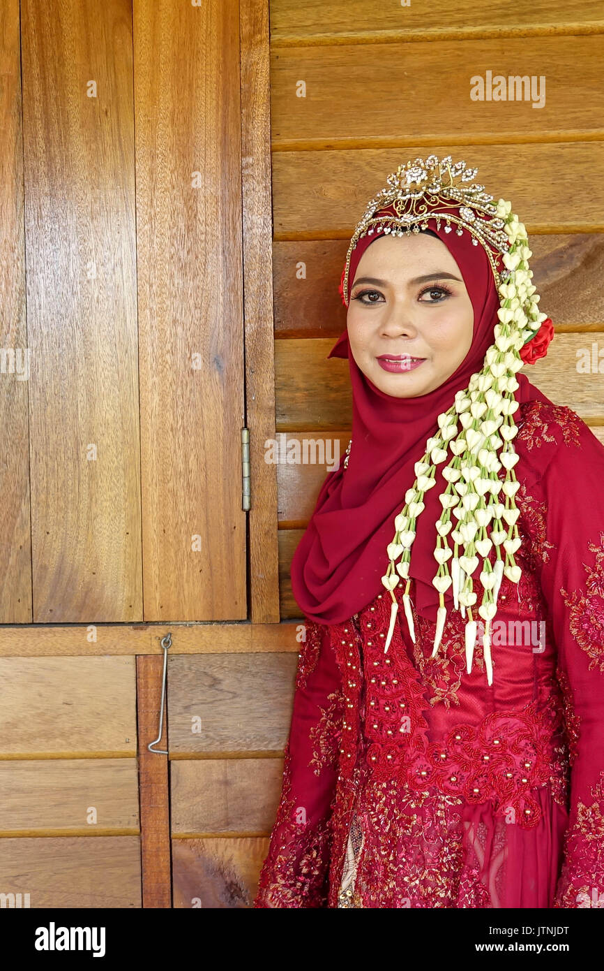 Traditional javanese wedding couple bride and bridegroom at garden ...