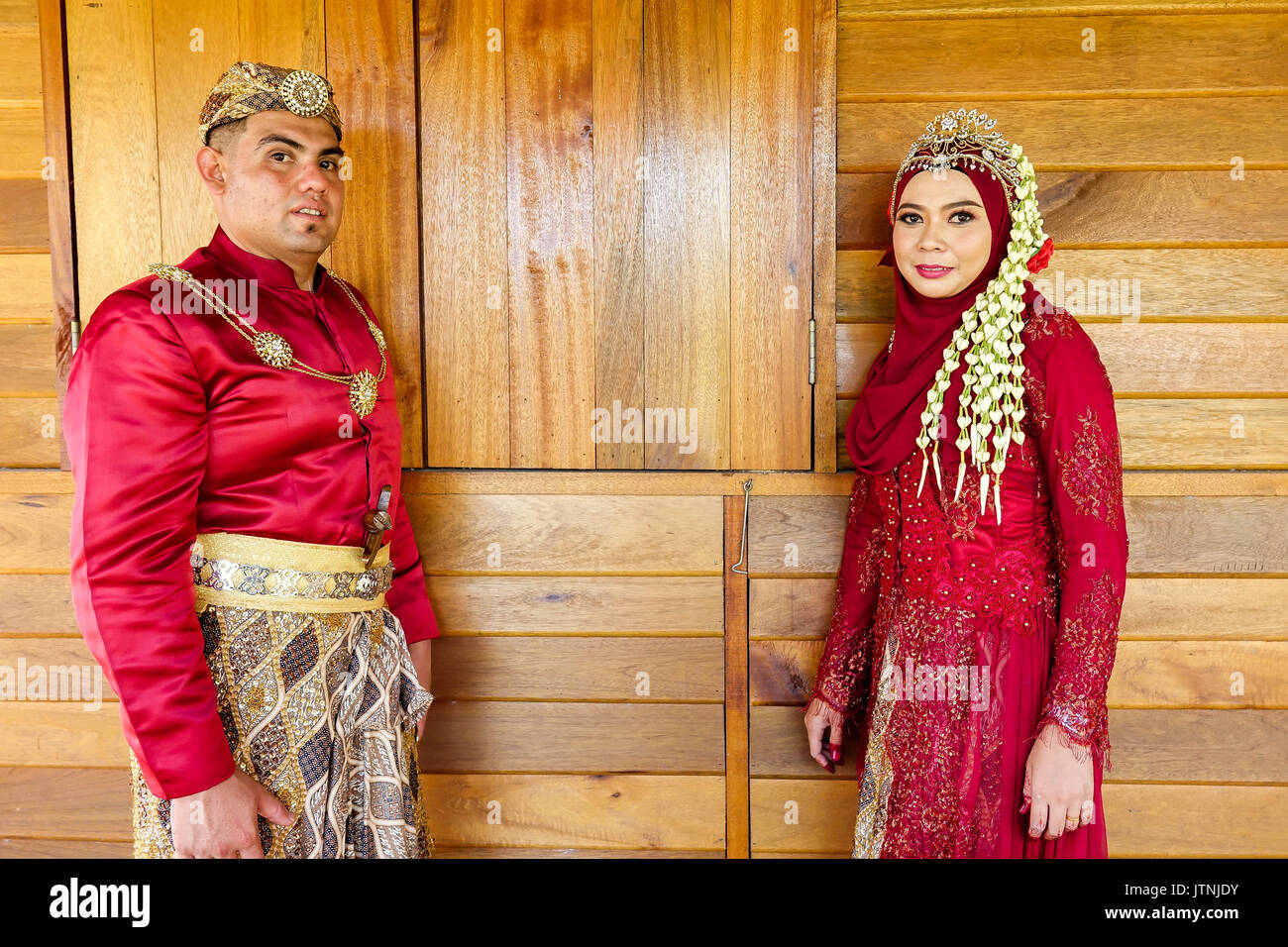Traditional javanese wedding couple bride and bridegroom at garden ...