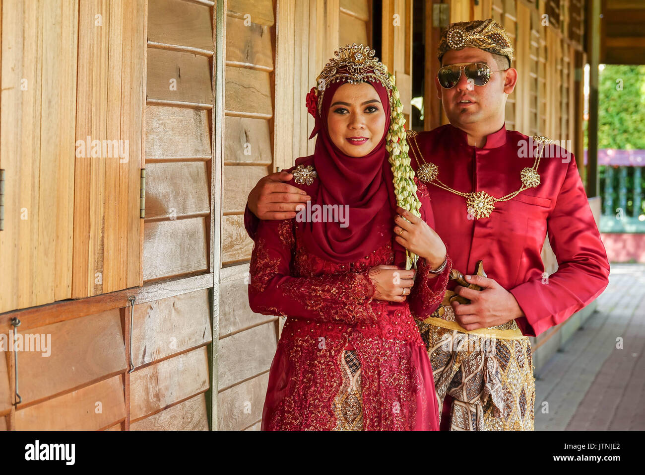 Traditional javanese wedding couple bride and bridegroom at garden ...