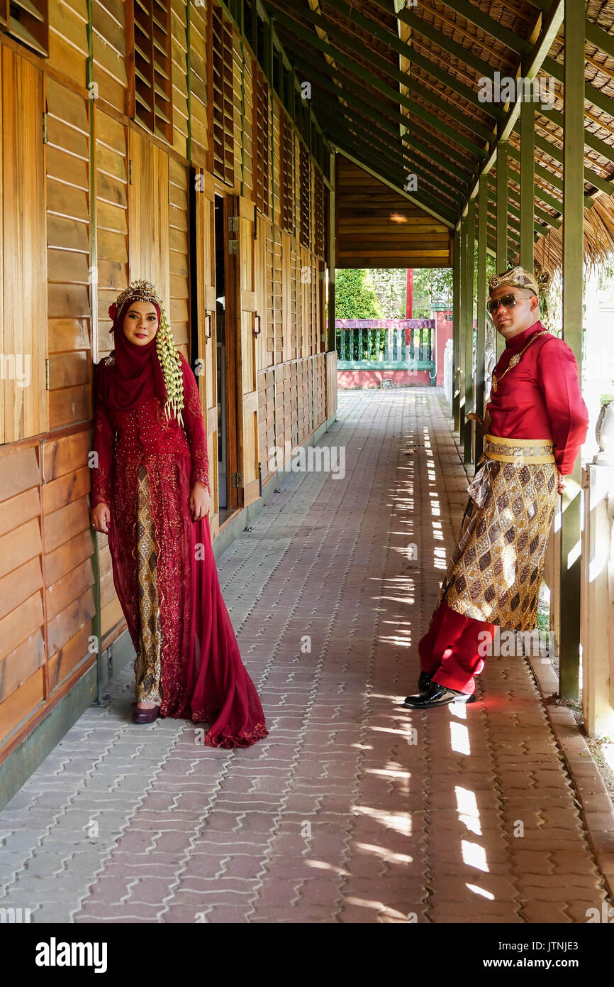Traditional javanese wedding couple bride and bridegroom at garden ...