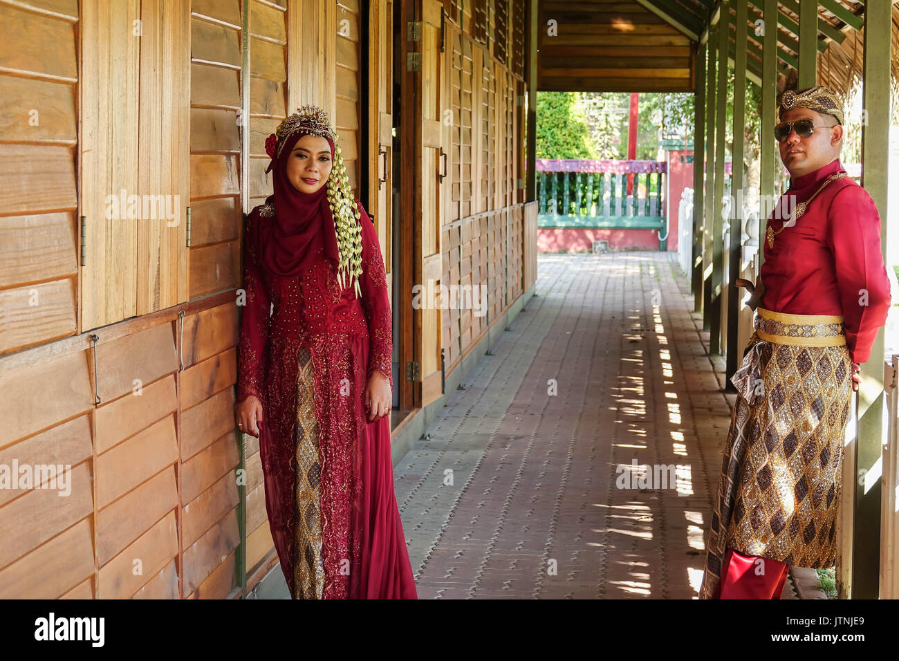Traditional javanese wedding couple bride and bridegroom at garden ...