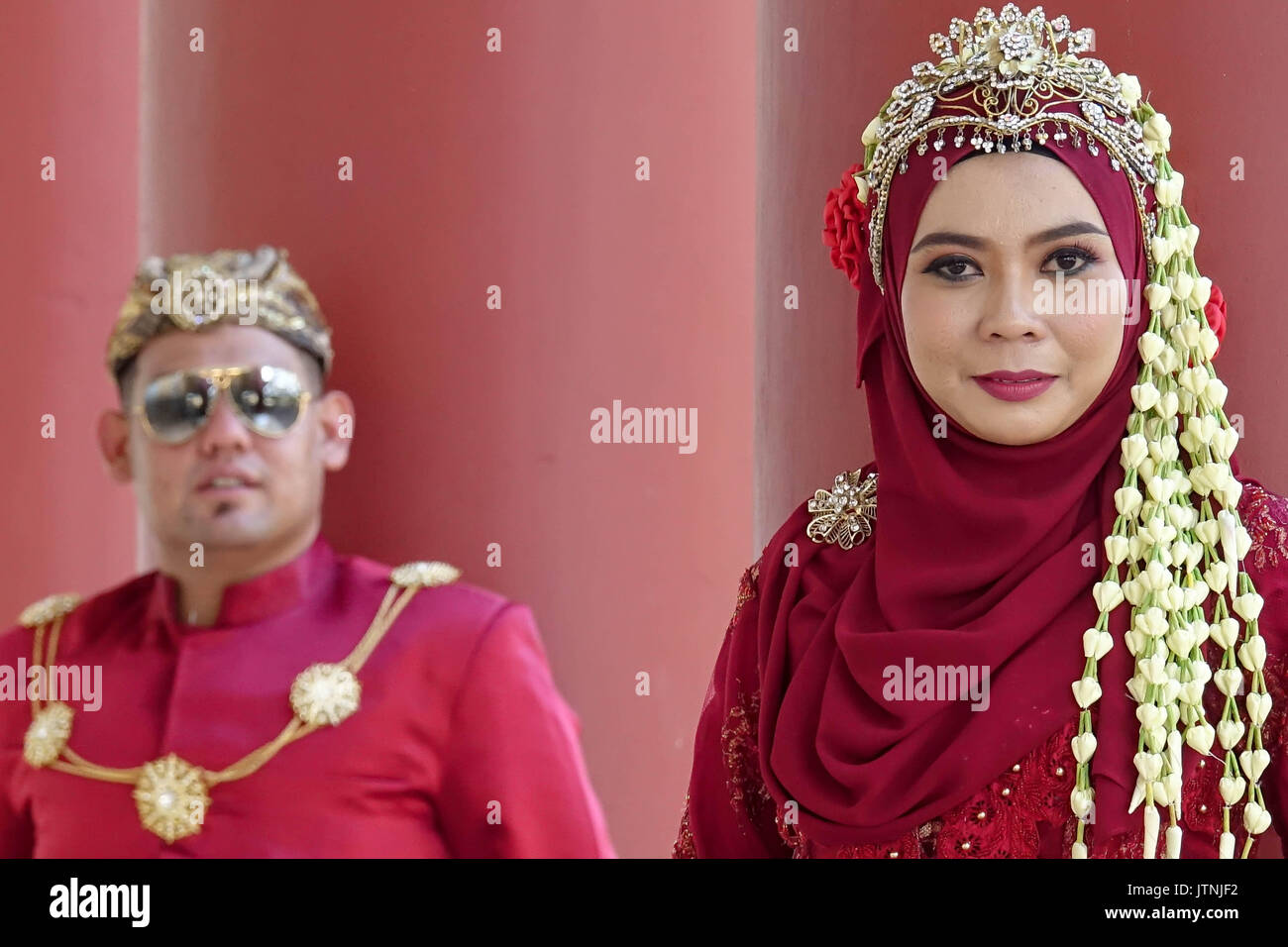 Traditional javanese wedding couple bride and bridegroom at garden ...