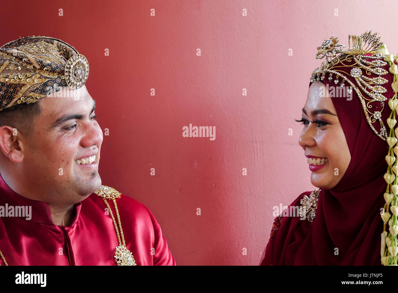 Traditional javanese wedding couple bride and bridegroom at garden ...