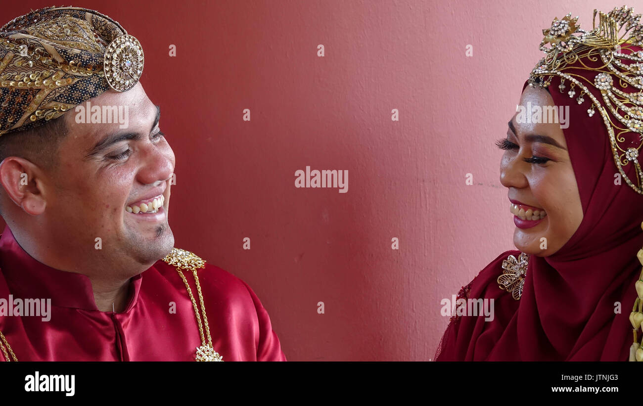 Traditional javanese wedding couple bride and bridegroom at garden ...