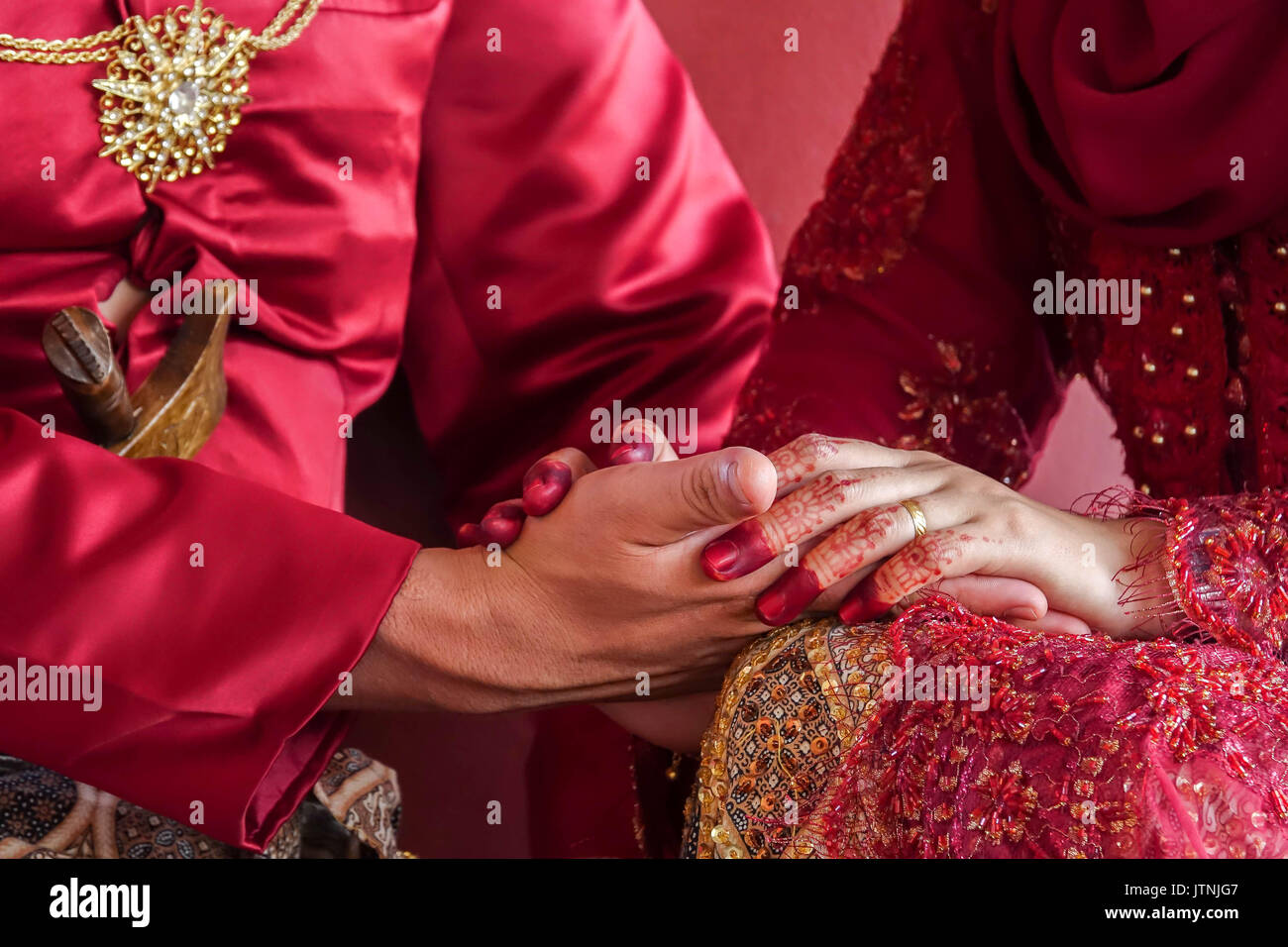 Traditional javanese wedding couple bride and bridegroom at garden ...