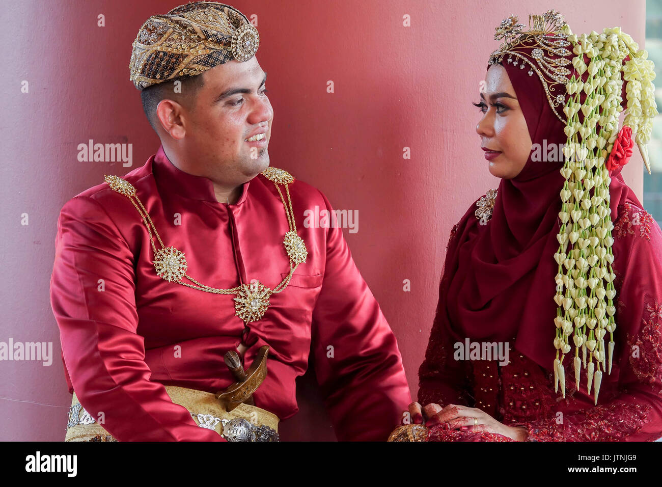 Traditional javanese wedding couple bride and bridegroom at garden ...