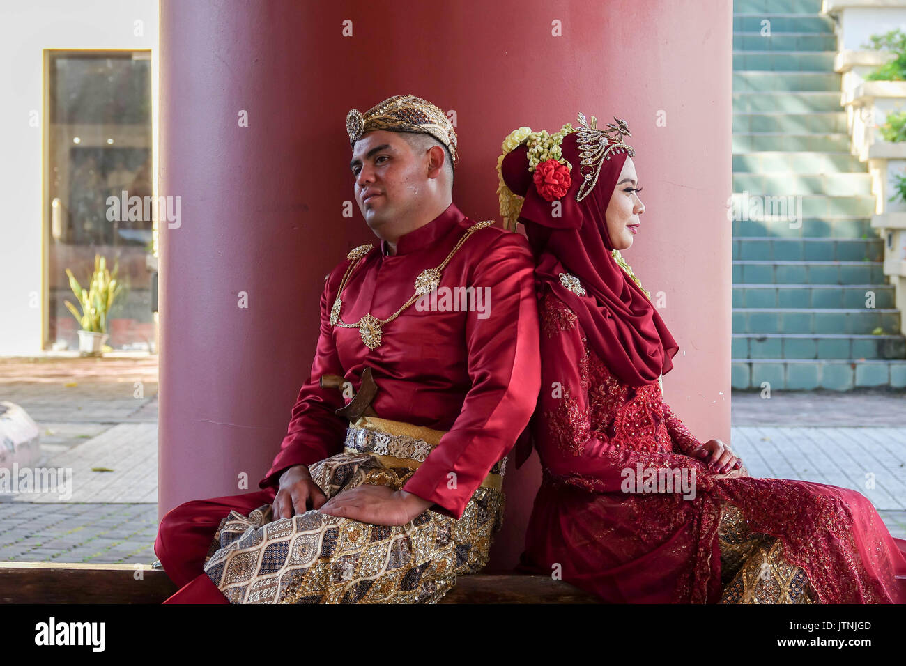 Traditional javanese wedding couple bride and bridegroom at garden ...