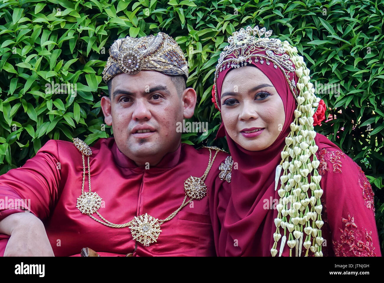 Traditional javanese wedding couple bride and bridegroom at garden ...